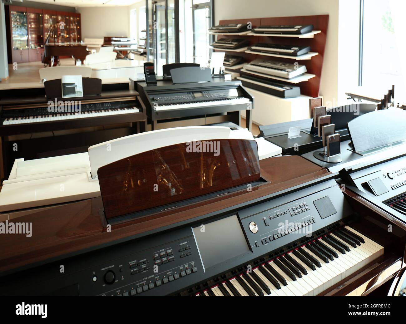 Piano in music shop Stock Photo - Alamy