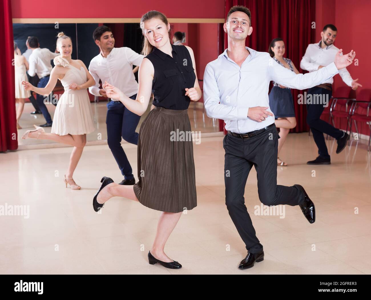 Positive people practicing vigorous twist movements Stock Photo - Alamy