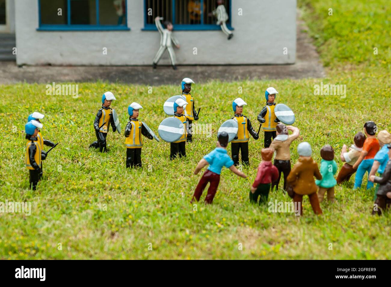 Closeup photo of tiny model riot police and protesters having a ...
