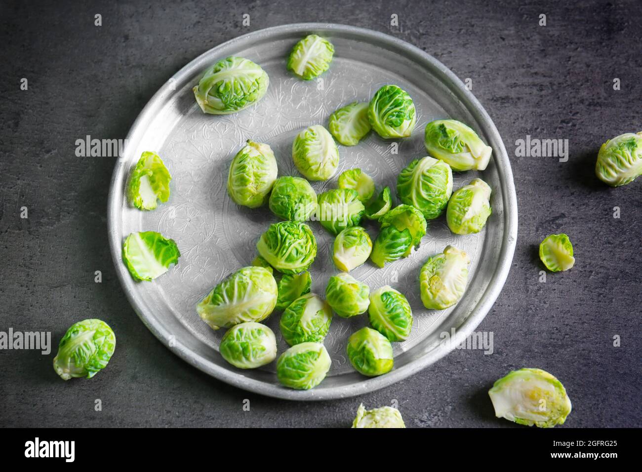 Metal tray with brussels sprouts on table Stock Photo - Alamy