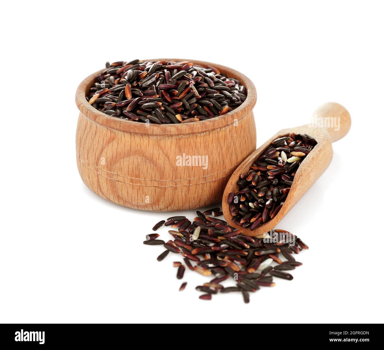 Dark wild rice in wooden bowl and scoop on white background Stock Photo ...