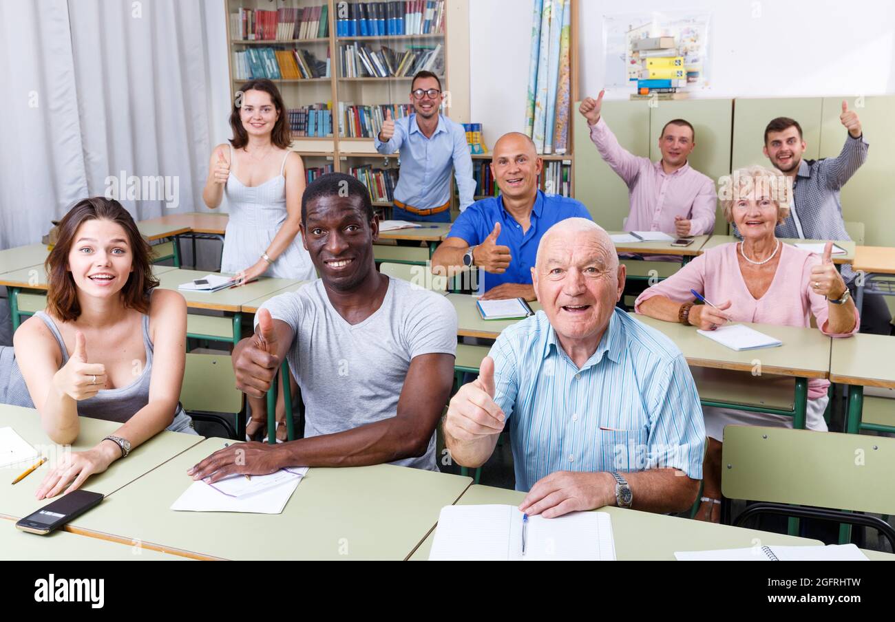 Students different ages satisfied results exam Stock Photo - Alamy