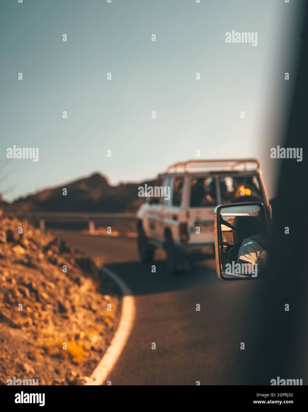 Shallow focus vertical shot of two cars on a highway Stock Photo - Alamy