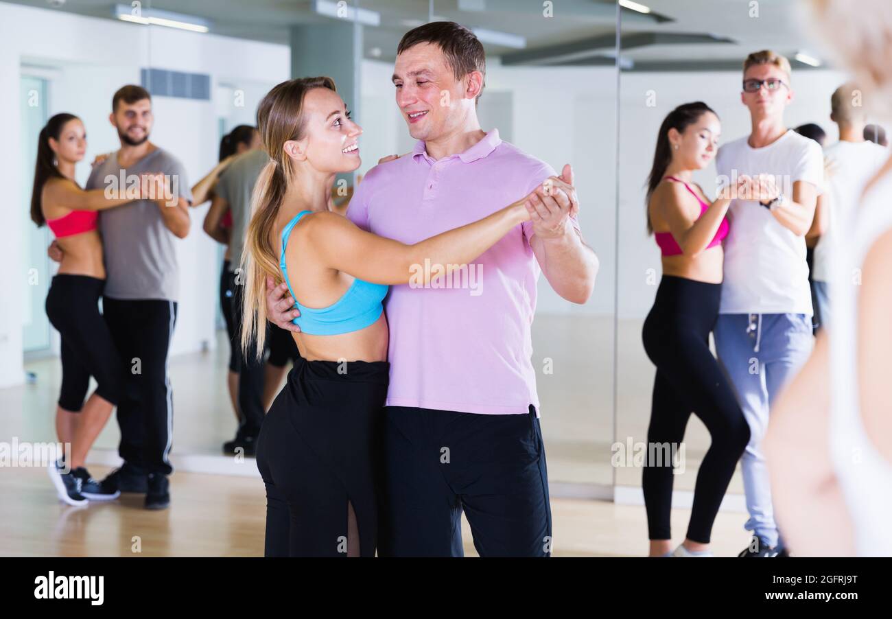 Smiling dancing pair dance tango together Stock Photo - Alamy