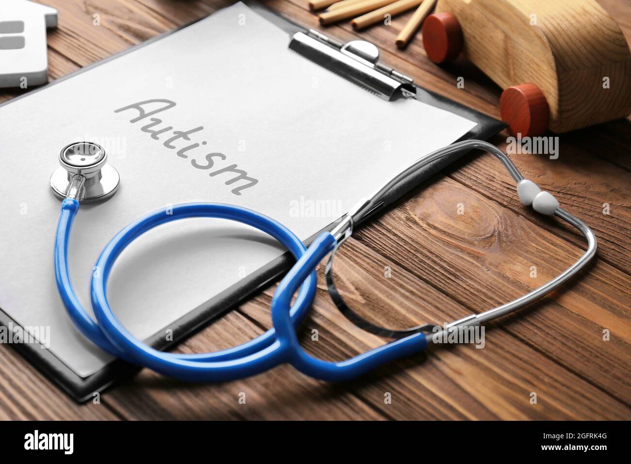Pediatrician workplace with clipboard and stethoscope. Autism concept ...