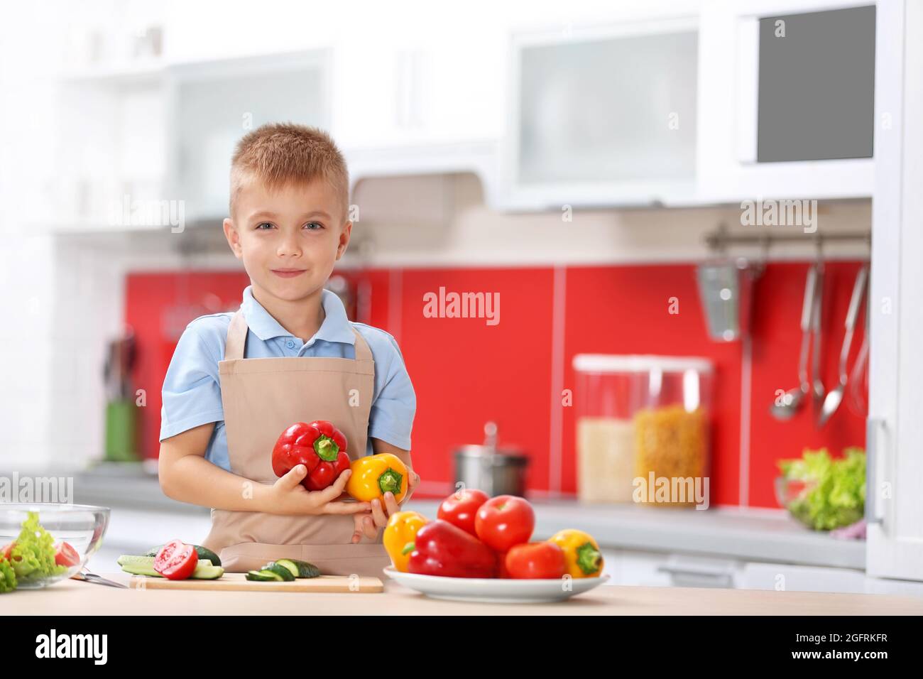 Little boy cooking in the kitchen Stock Photo - Alamy