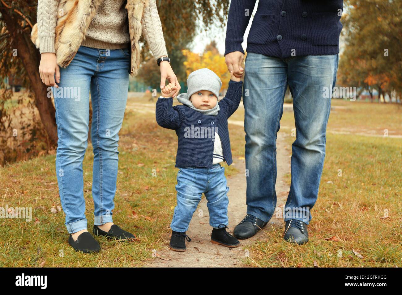 Baby boy with parents walking outdoors Stock Photo - Alamy