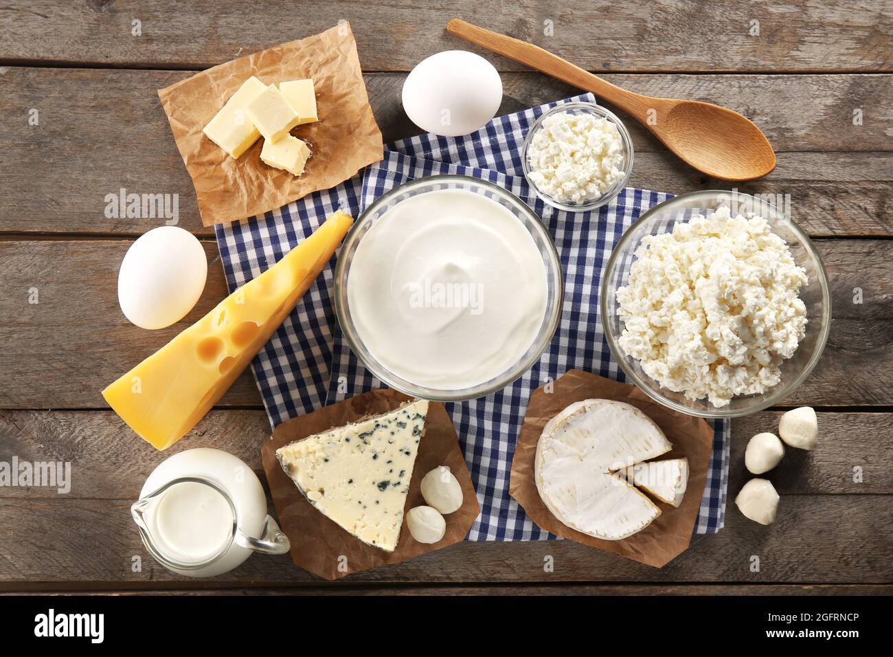 Different types of dairy products on wooden background Stock Photo - Alamy
