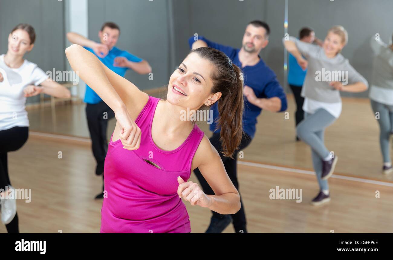 Woman training at group dance class Stock Photo - Alamy