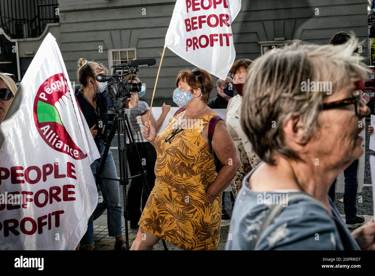 Protesters hold flags during the demonstration.A group of protestors ...