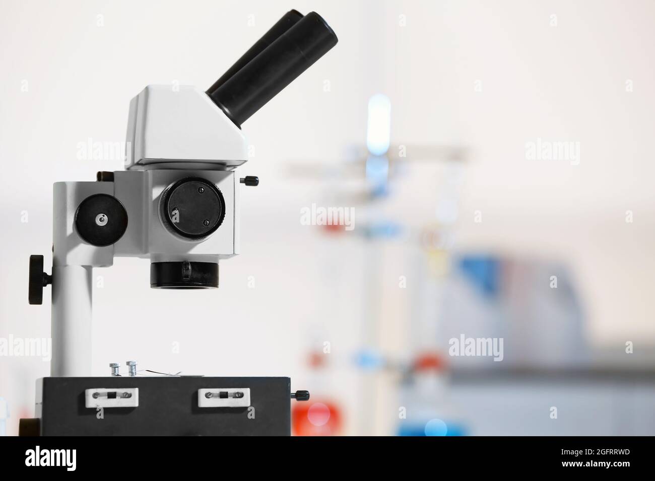 Modern microscope in office Stock Photo - Alamy