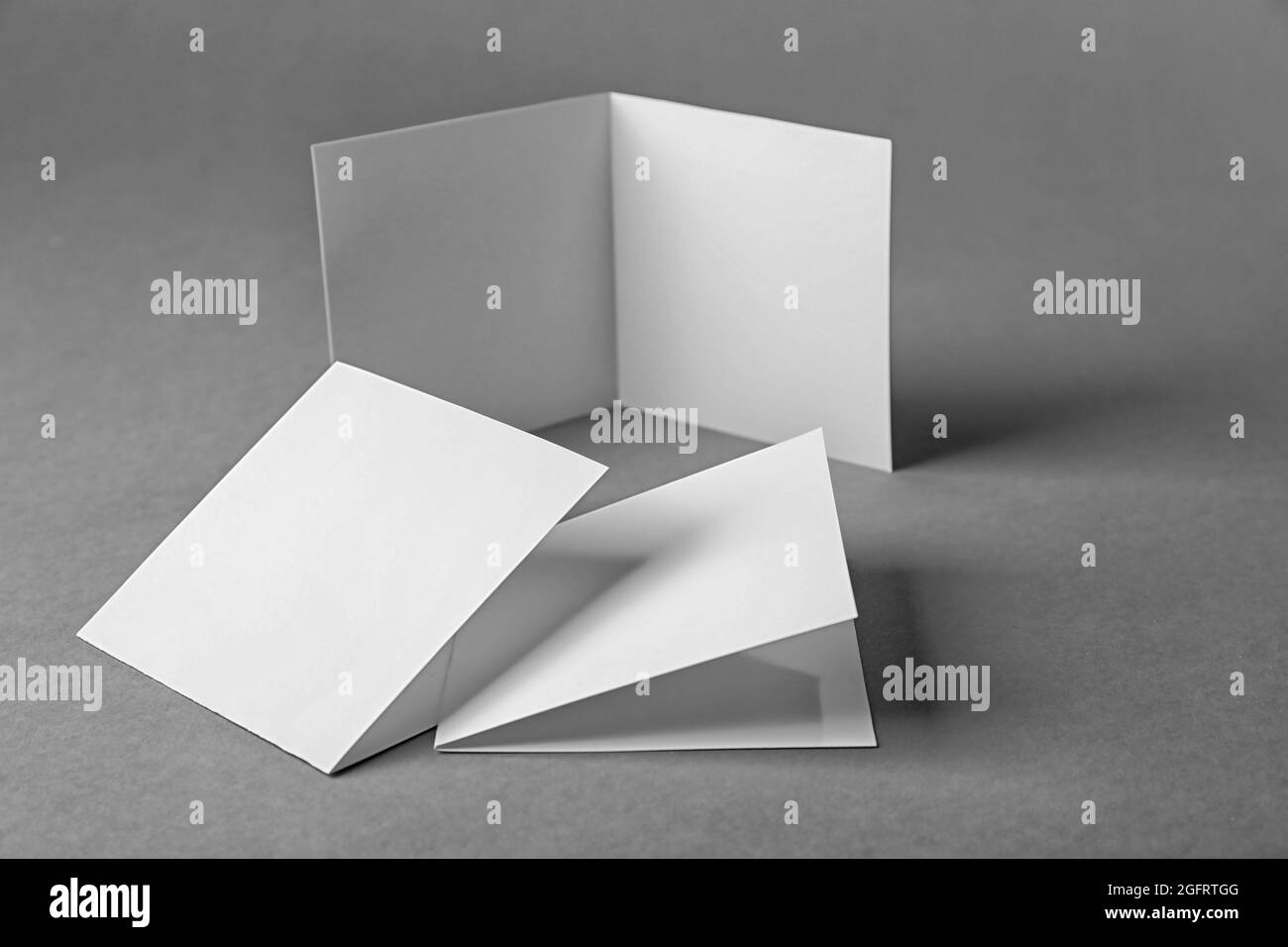 Blank booklets on grey background Stock Photo - Alamy