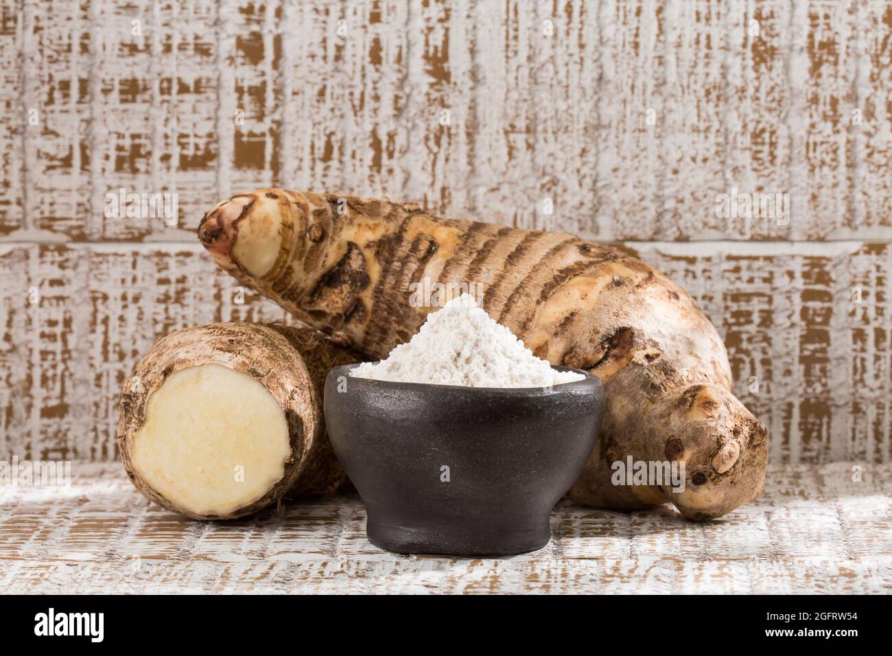 Taro Root of Colocasia esculenta and Organic Taro Flour in a bowl Stock ...