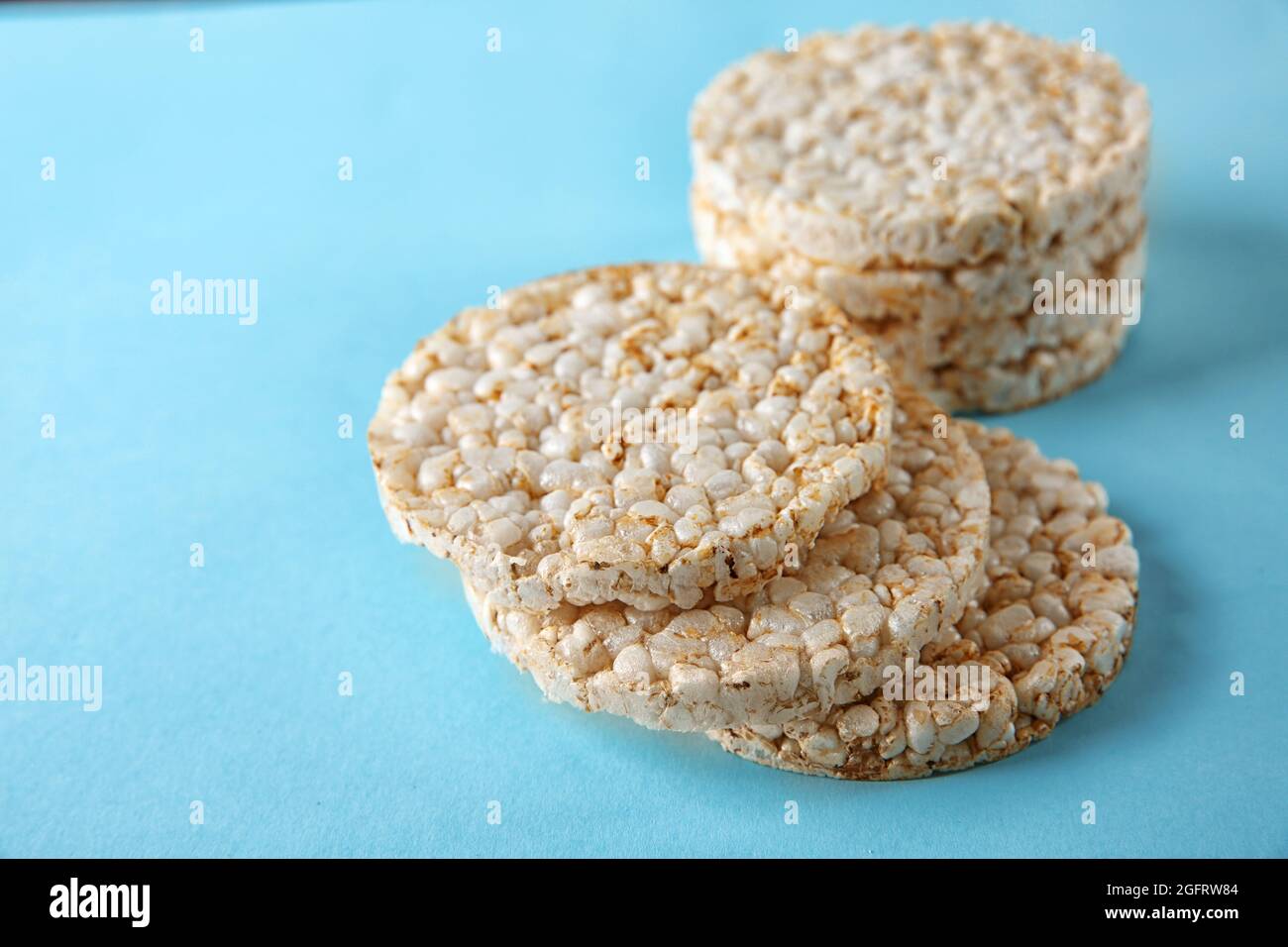 Rice crackers on blue background Stock Photo - Alamy