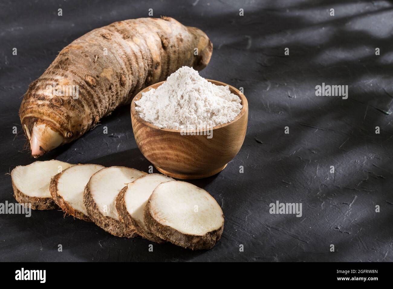 Taro Root of Colocasia esculenta and Organic Taro Flour in a bowl Stock ...