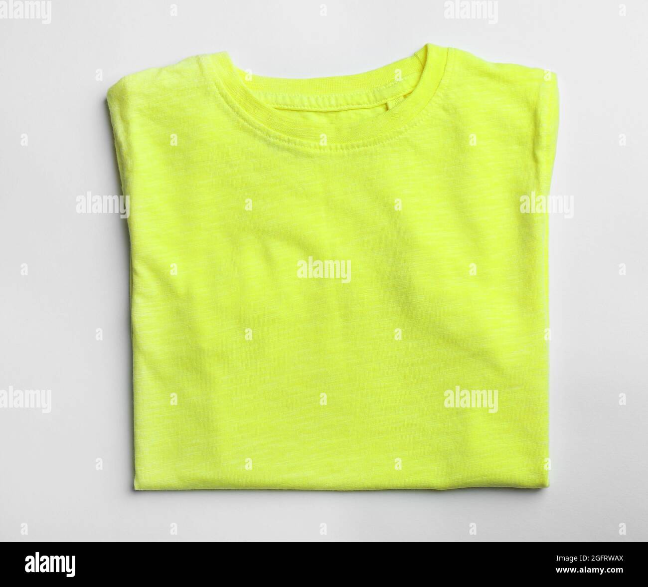 Blank color t-shirt on white background Stock Photo - Alamy