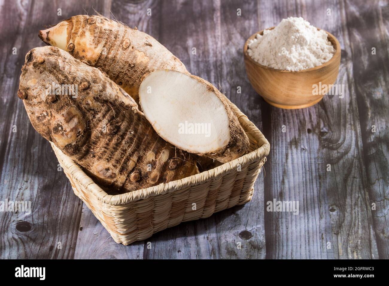 Taro Root of Colocasia esculenta and Organic Taro Flour in a bowl Stock ...