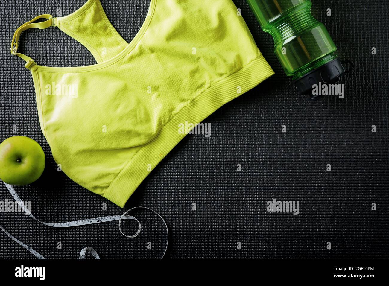 Clothes and items for sport on dark background Stock Photo - Alamy
