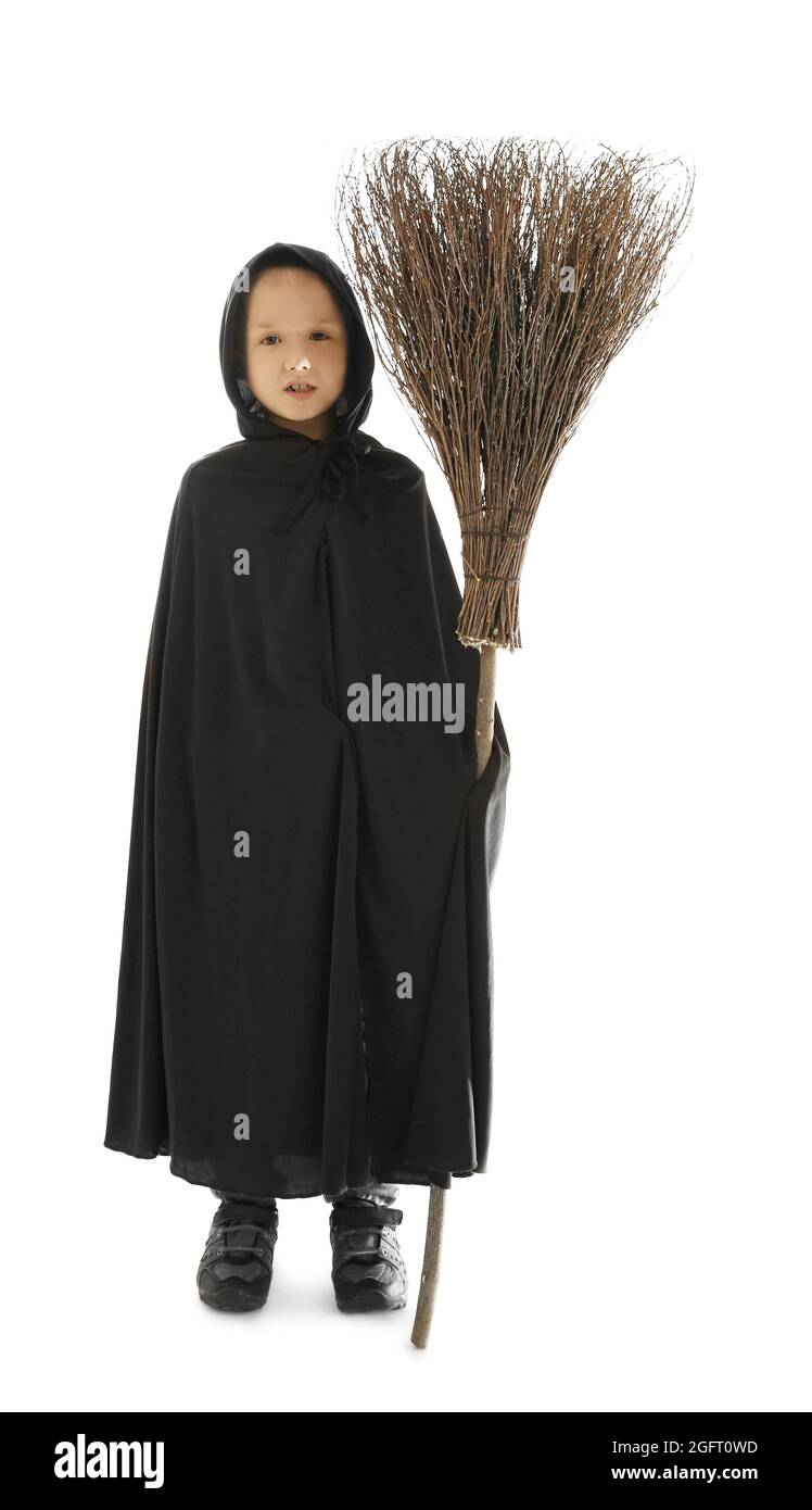 Cute boy with broom in Halloween costume on light background Stock ...