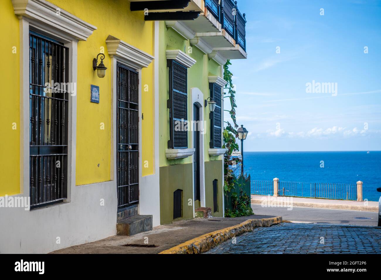 A yellow and green building out looks the ocean. - Puerto Rico Stock ...