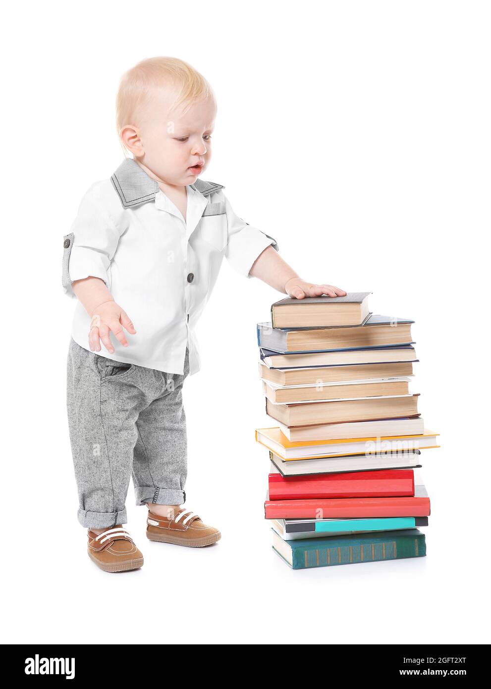 Baby boy with books on white background Stock Photo - Alamy