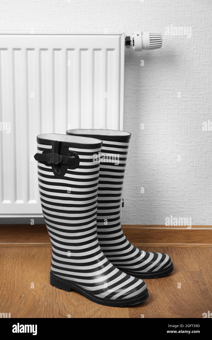 Heating radiator with rubber boots Stock Photo - Alamy