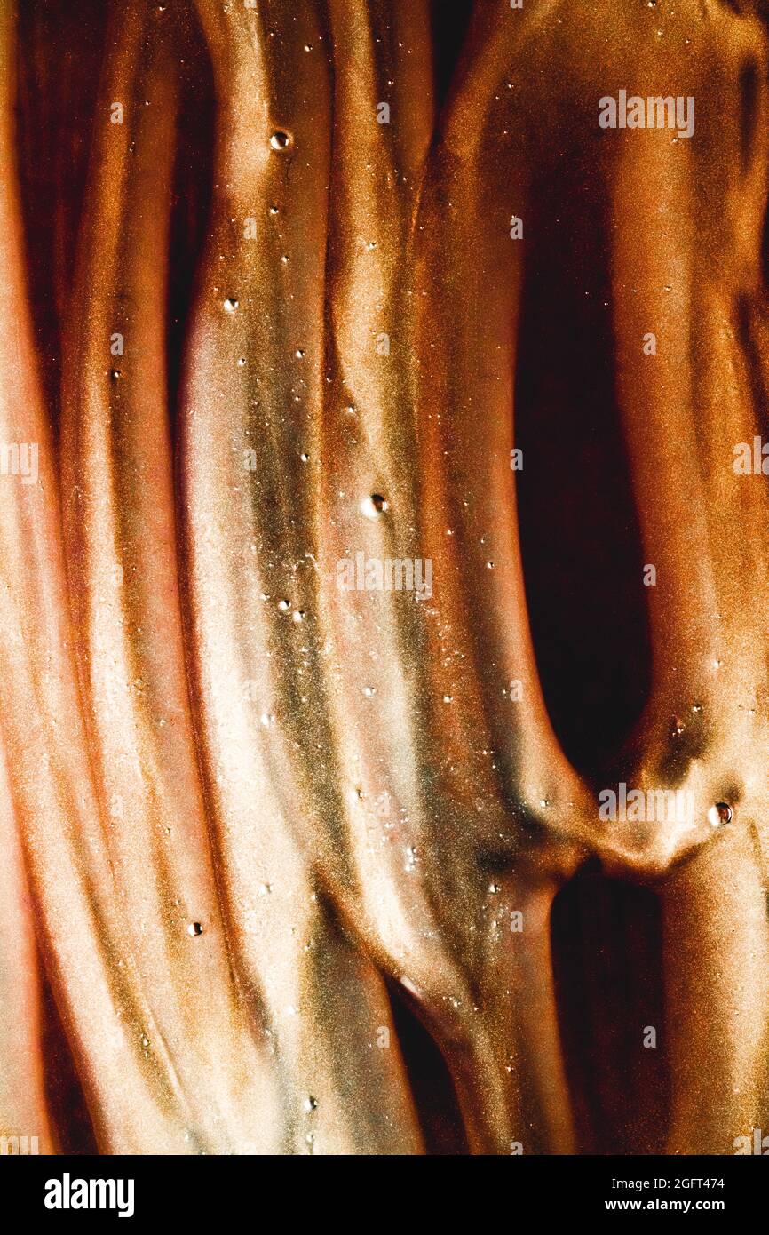 Abstract bronze liquid background, paint splash, swirl pattern and ...