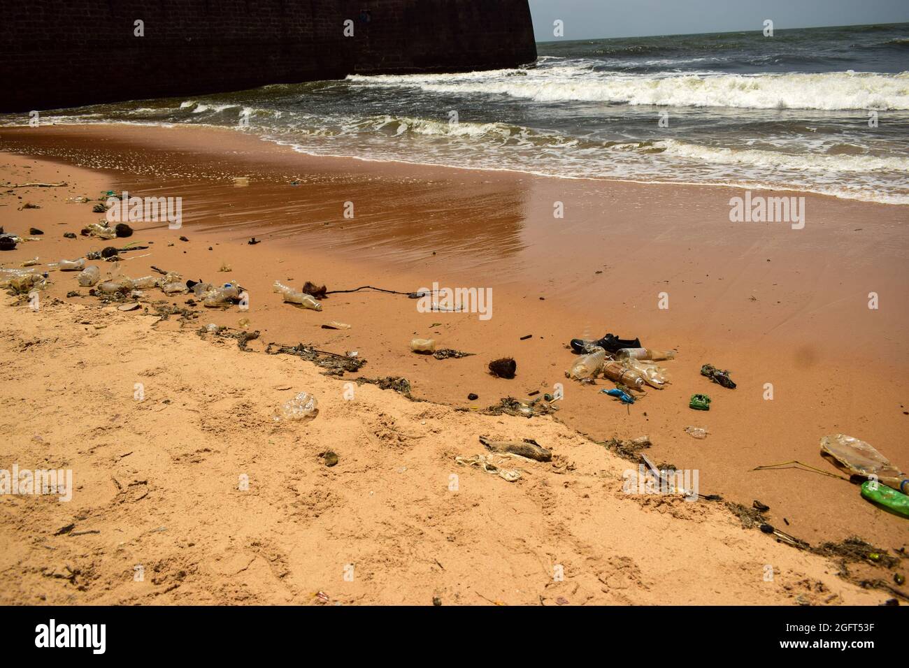 Ocean-Sea Waves Beach Sand and Garbage Stock Photo - Alamy