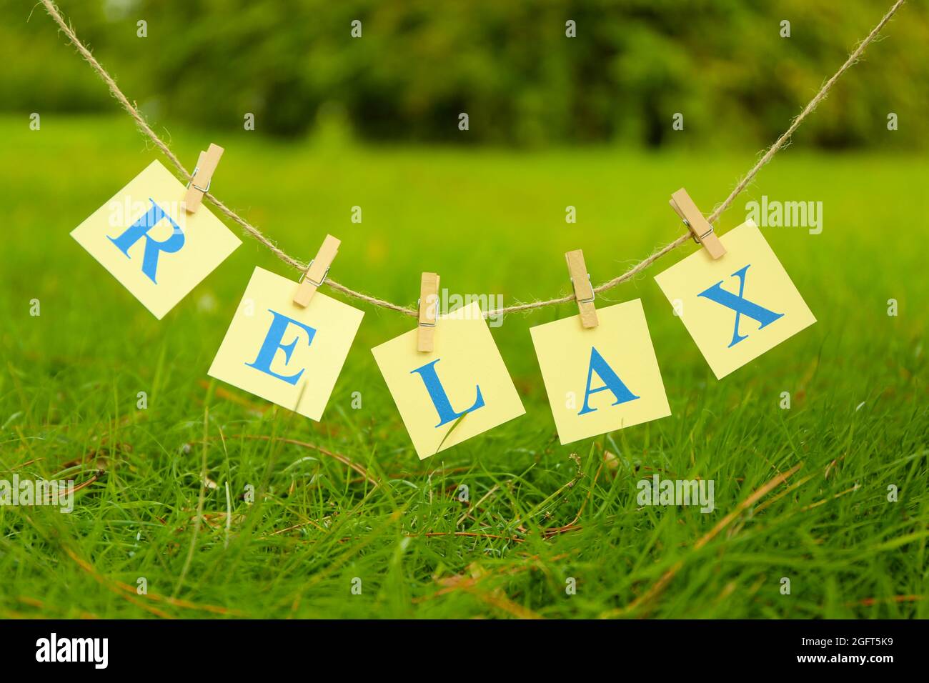 Cards with printed word RELAX on nature background Stock Photo - Alamy
