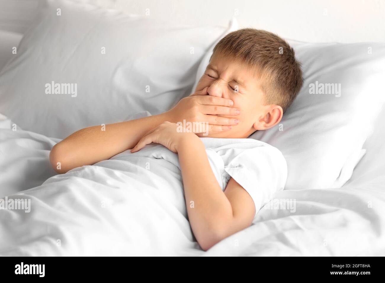 Small sick boy in bed Stock Photo - Alamy