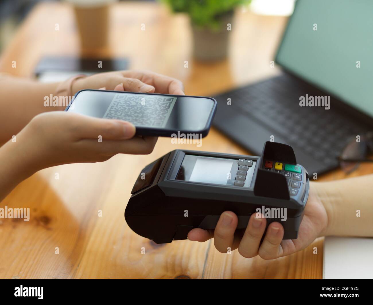 Closeup, The customer scanning QR code on terminal payment to pay the ...