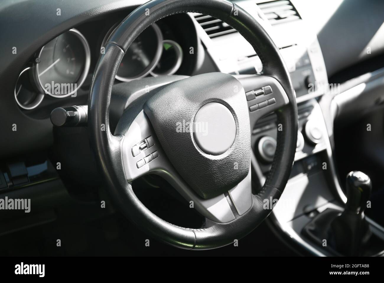 Steering wheel in car interior, closeup Stock Photo - Alamy