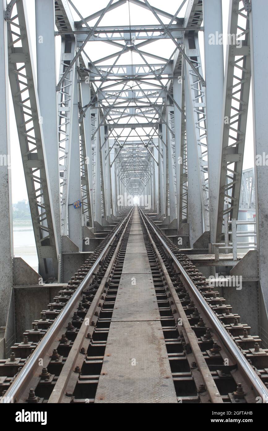 The bridge of Indian Railways in Bihar, and railway workers working on ...