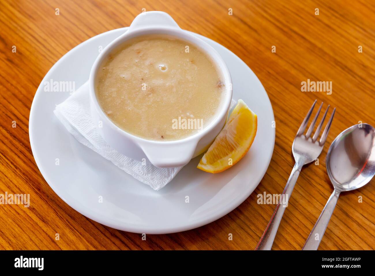 Traditional turkish chicken broth soup on wooden table top view Stock ...