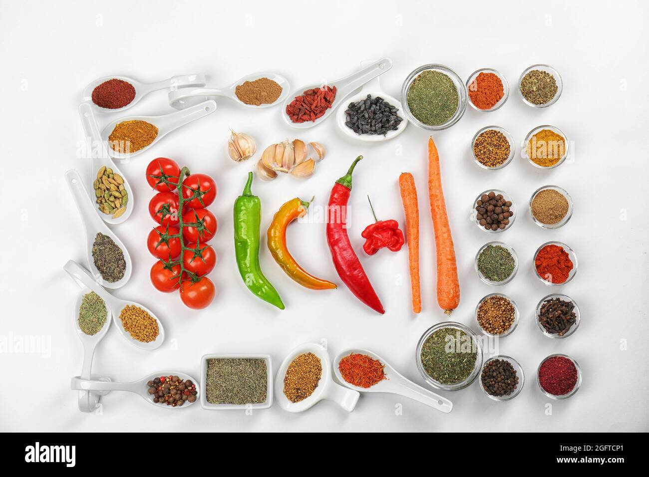 Different spices and fresh vegetables on white background Stock Photo ...