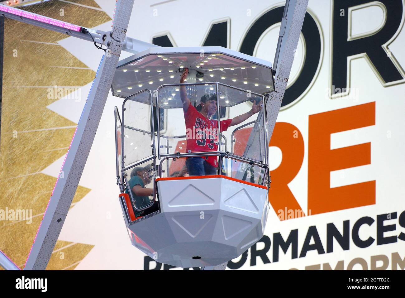 A limited-time Ferris Wheel opens in Times Square offering tourists and ...
