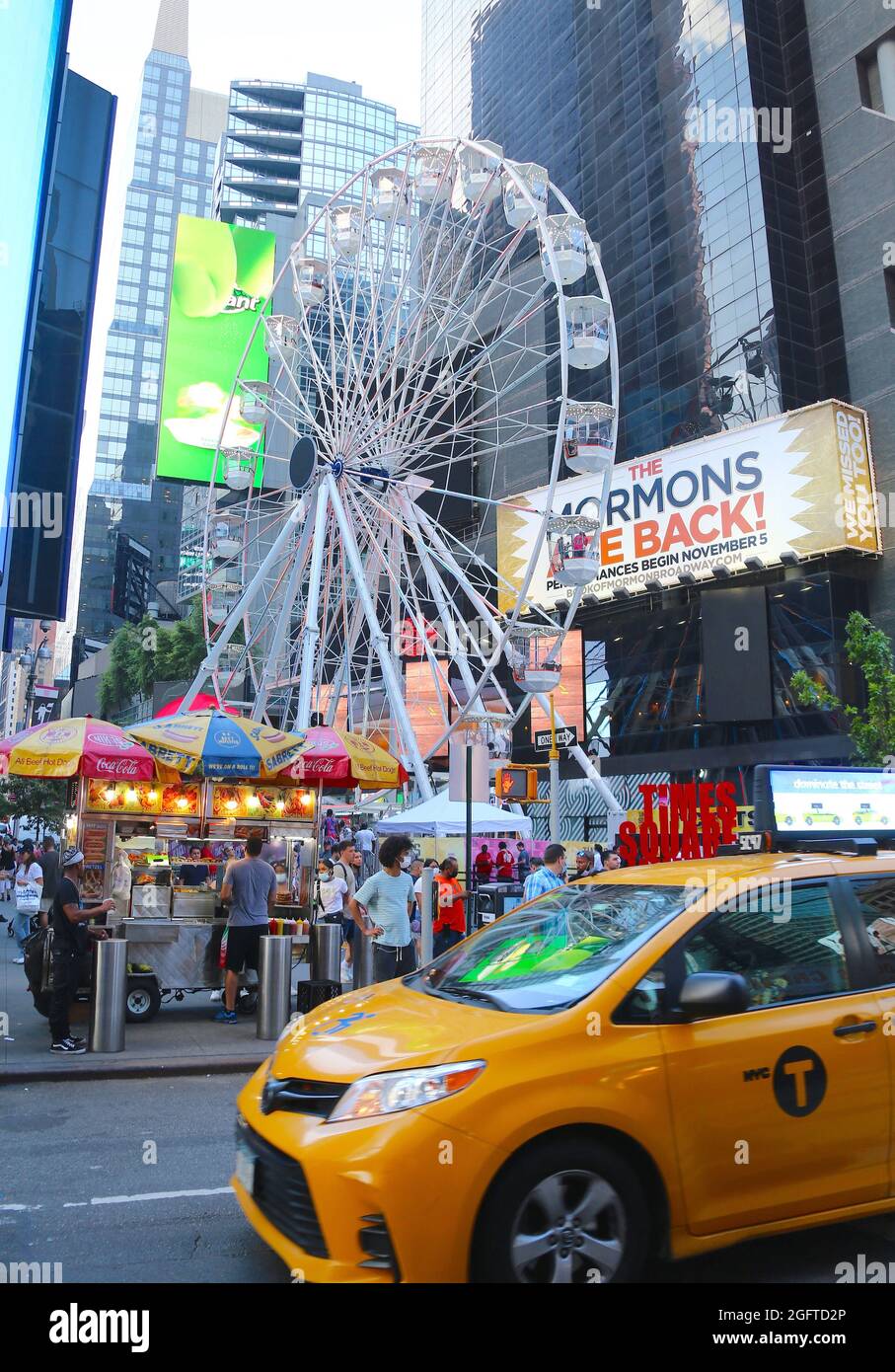 A limited-time Ferris Wheel opens in Times Square offering tourists and ...