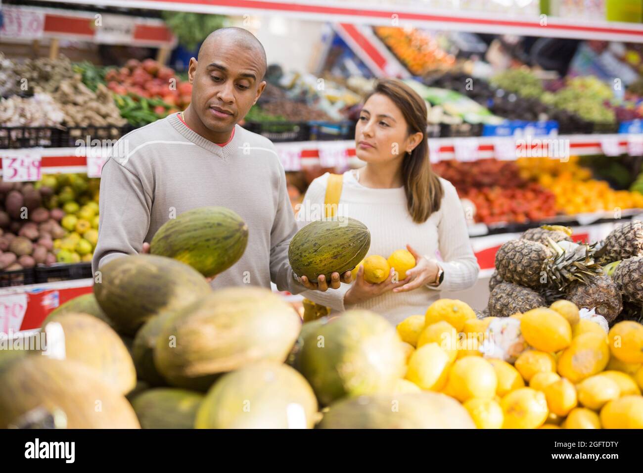 Young woman two melons hi-res stock photography and images - Alamy