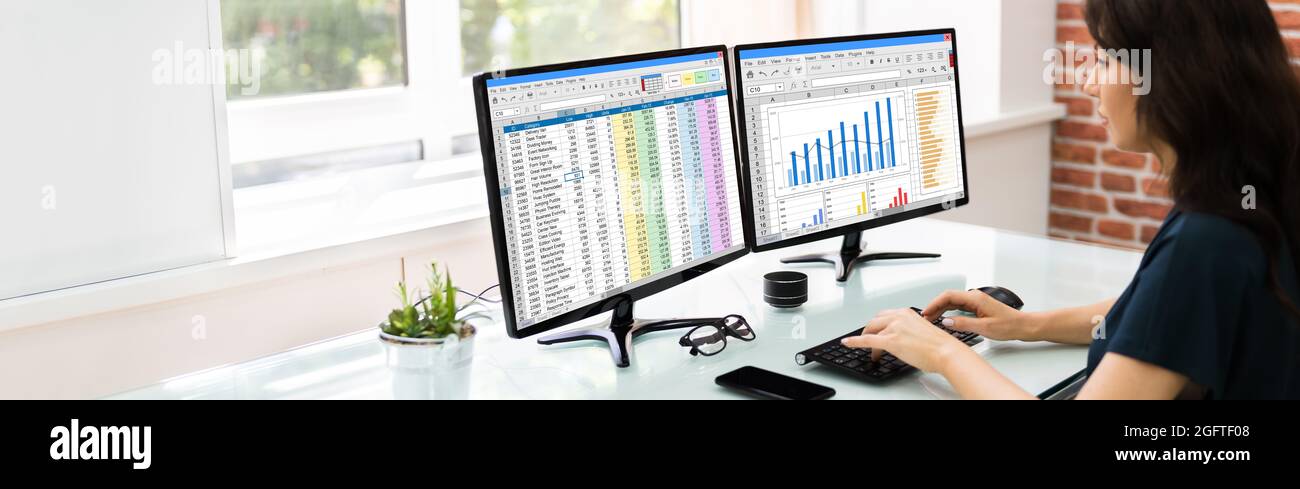 Business Woman Working With Spreadsheet Graphs On Computer Stock Photo ...