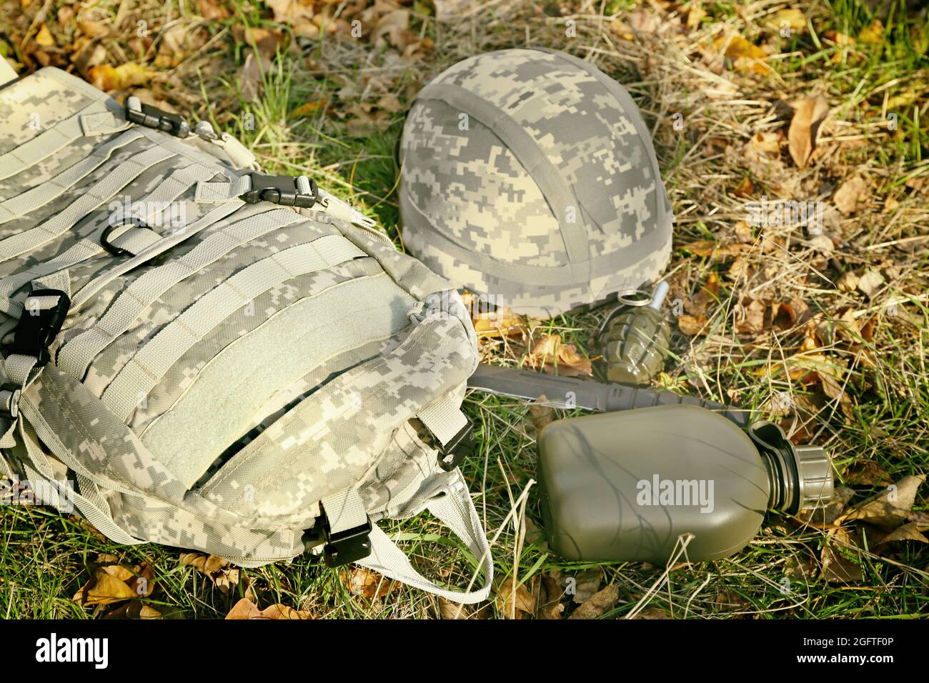 Military set on grass background Stock Photo - Alamy