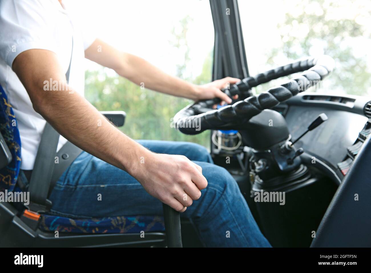 Hand of bus driver on gear lever Stock Photo - Alamy