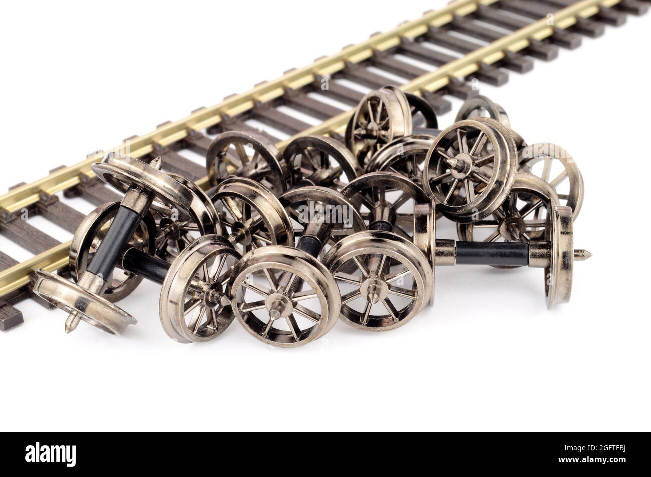 Group of metal spoked model railway wheels with axles in oo gauge or 1/ ...