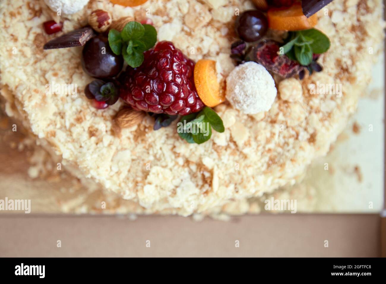 Sugar-free diet cake with honey, garnished with fruit and mint. Natural ...