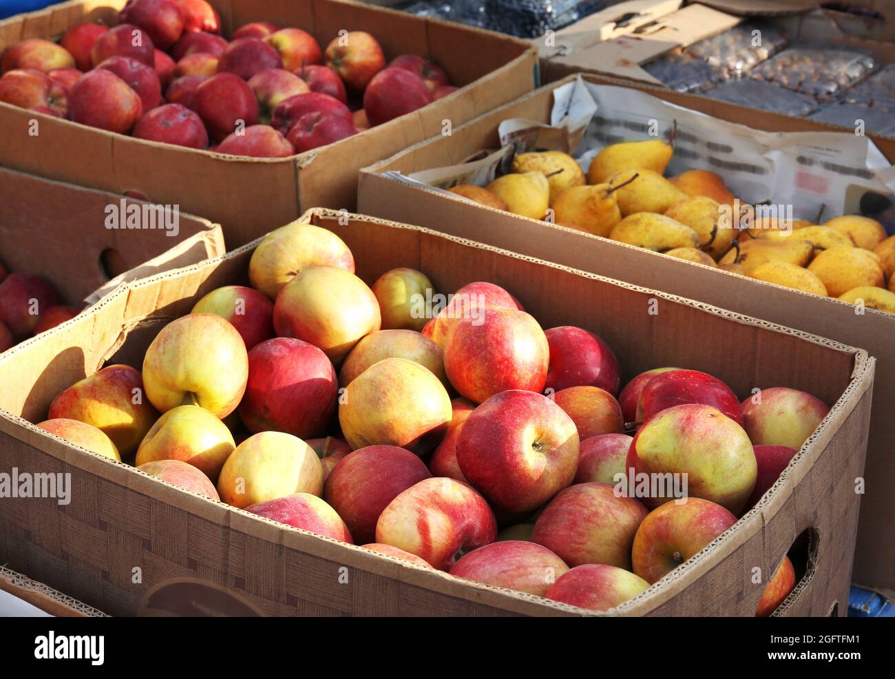 Fresh fruits in cardboard boxes on market Stock Photo - Alamy