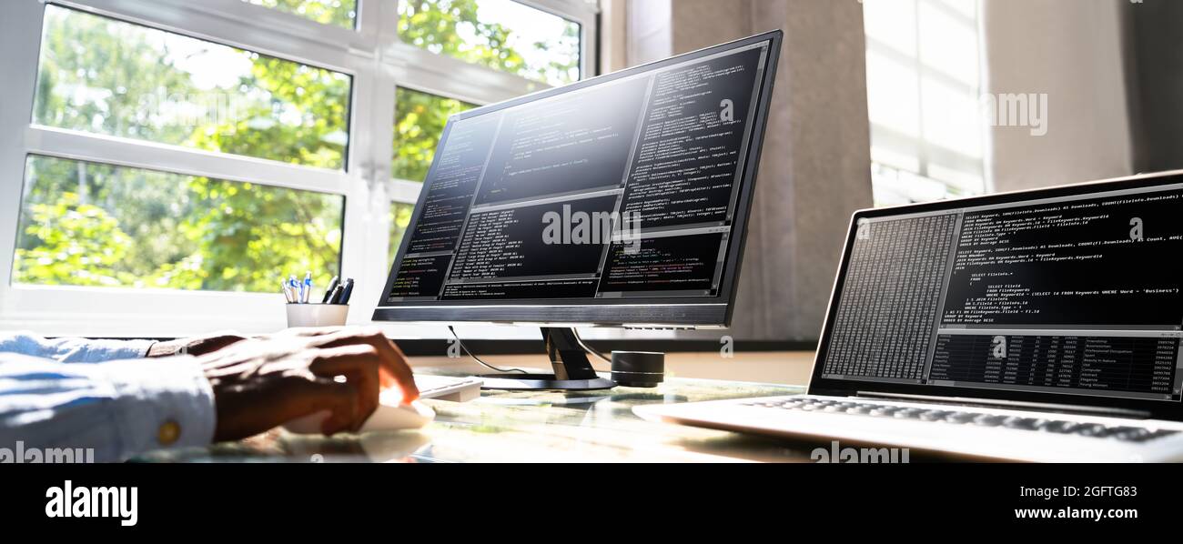 African American Coder Using Computer At Desk. Web Developer Stock ...