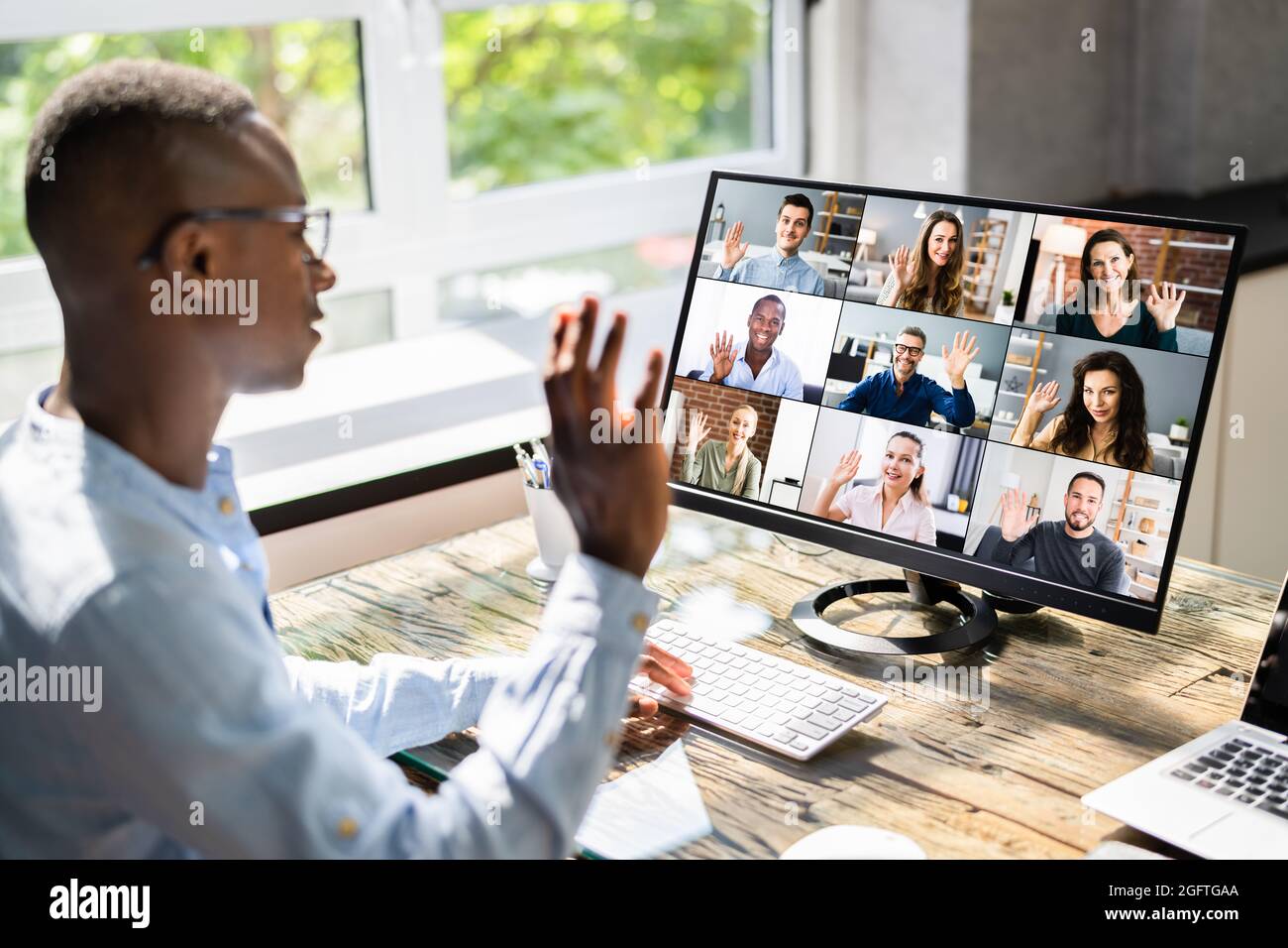 Virtual Video Conference Interview In Office Waving Hand Stock Photo ...