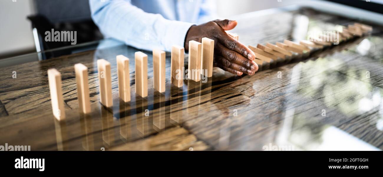 African American Business Man Domino Stop And Prevention Stock Photo ...