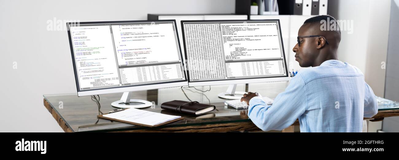 African American Coder Using Computer At Desk. Web Developer Stock ...