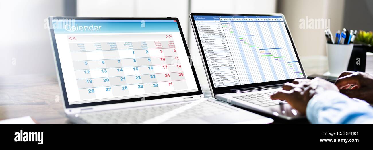 Gantt Chart Calendar Schedule On Multiple Laptop Computers Stock Photo ...