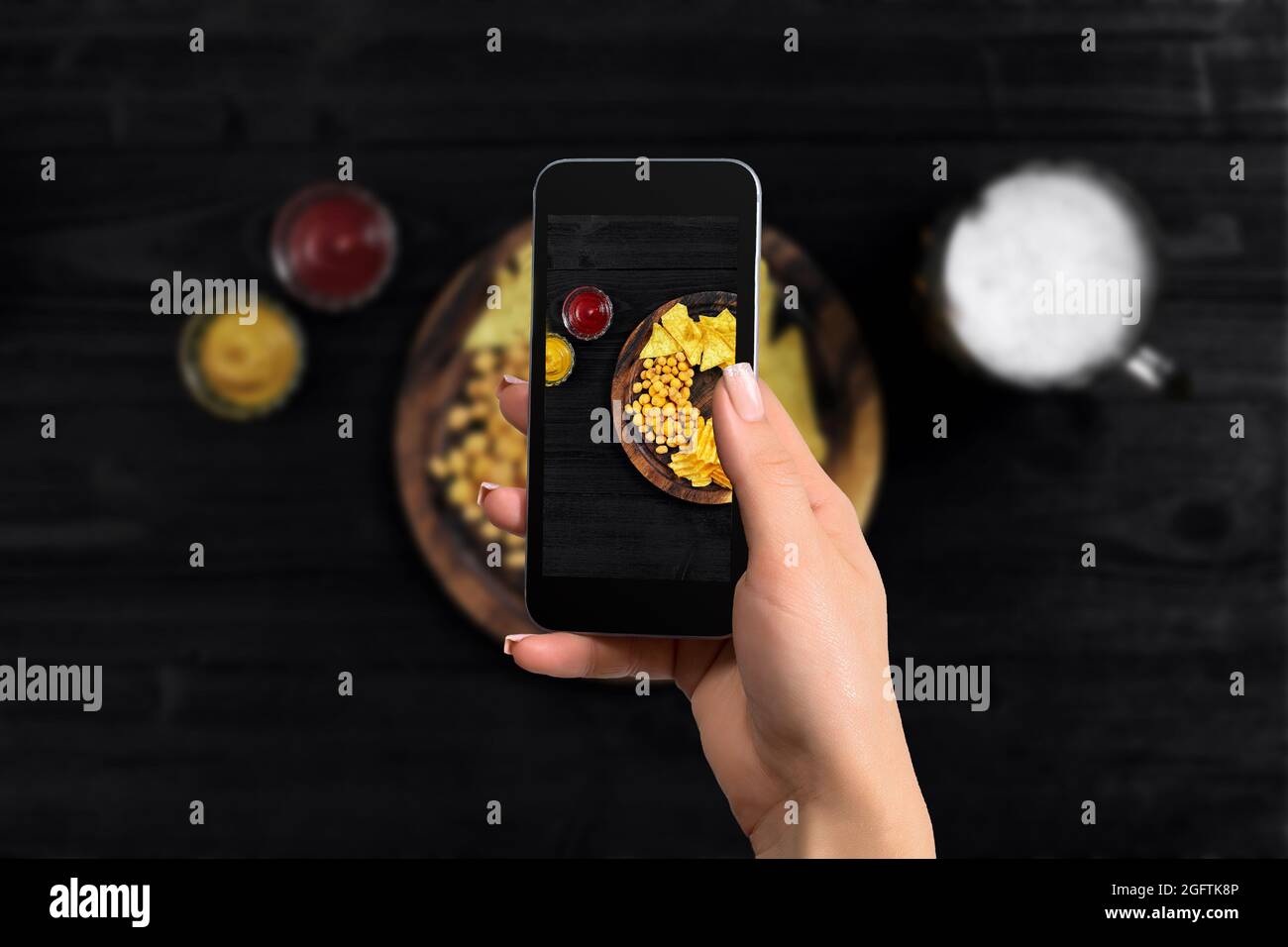 Hand's of woman taking picture photo food with mobile smart phone. Top ...